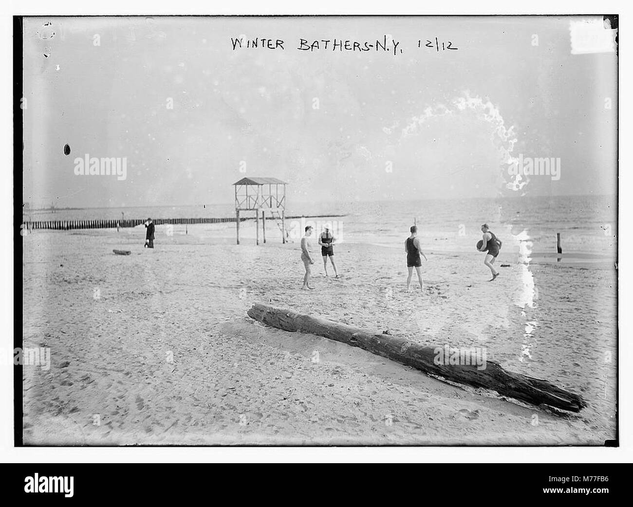 A photograph capturing winter bathers in New York, showcasing a unique ...