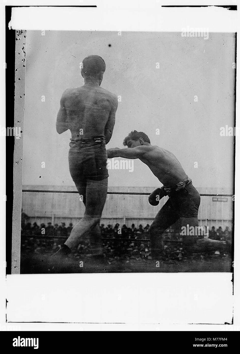 A moment from a boxing match showing Wolgast fouling Ritchie for the ...