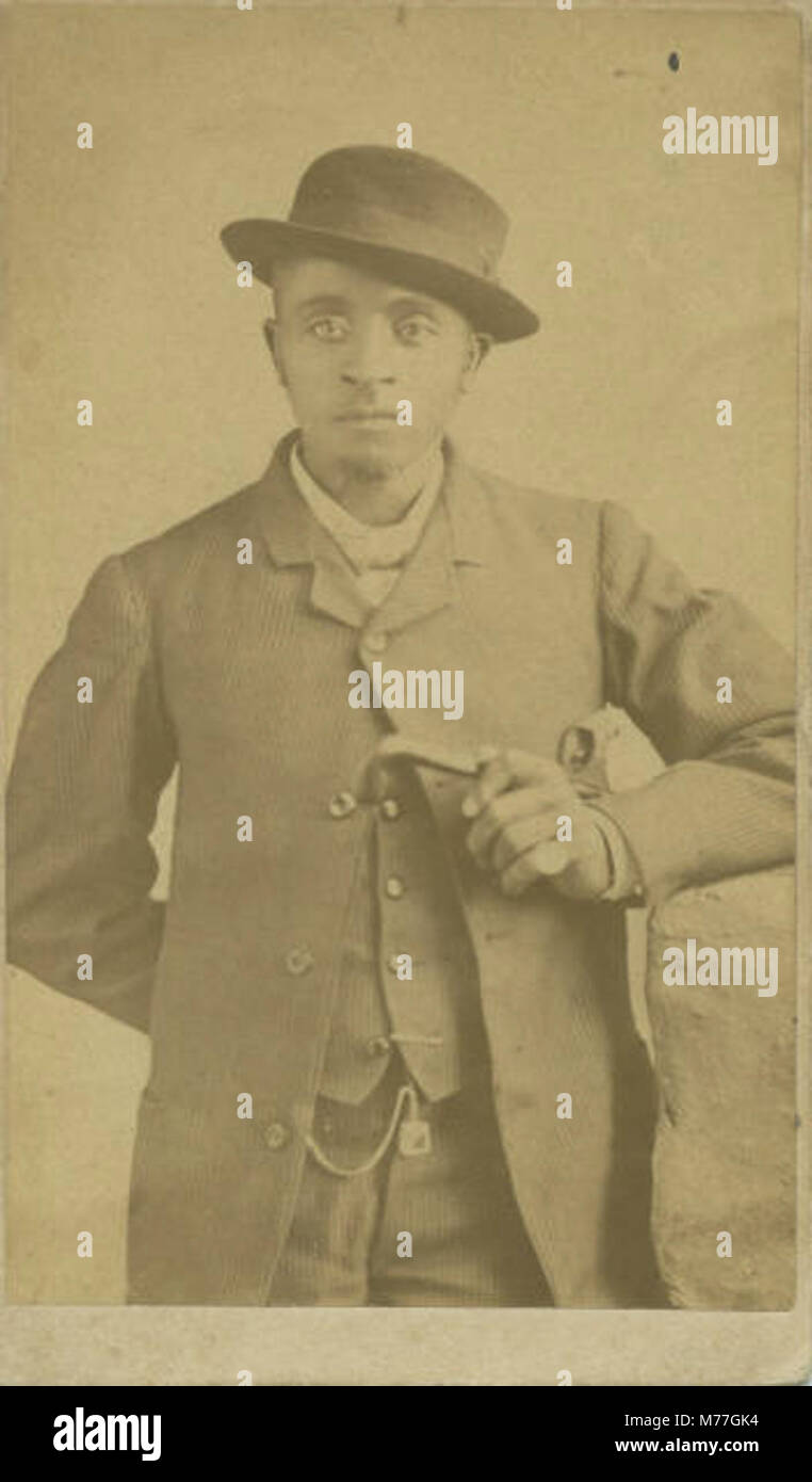 A portrait of a young man dressed in a suit, embodying early 20th ...