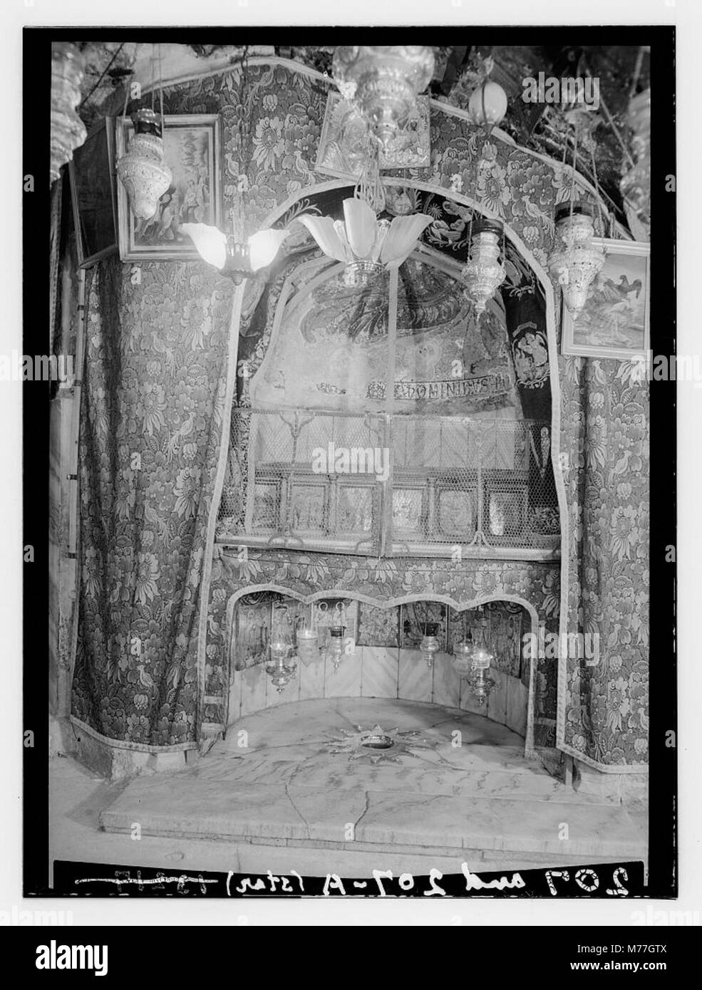 This photograph shows the Grotto of the Nativity in Bethlehem, a ...