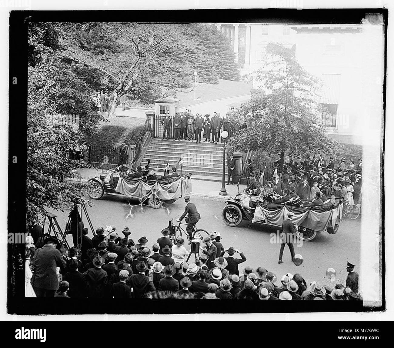A parade in progress, featuring participants and spectators in an ...