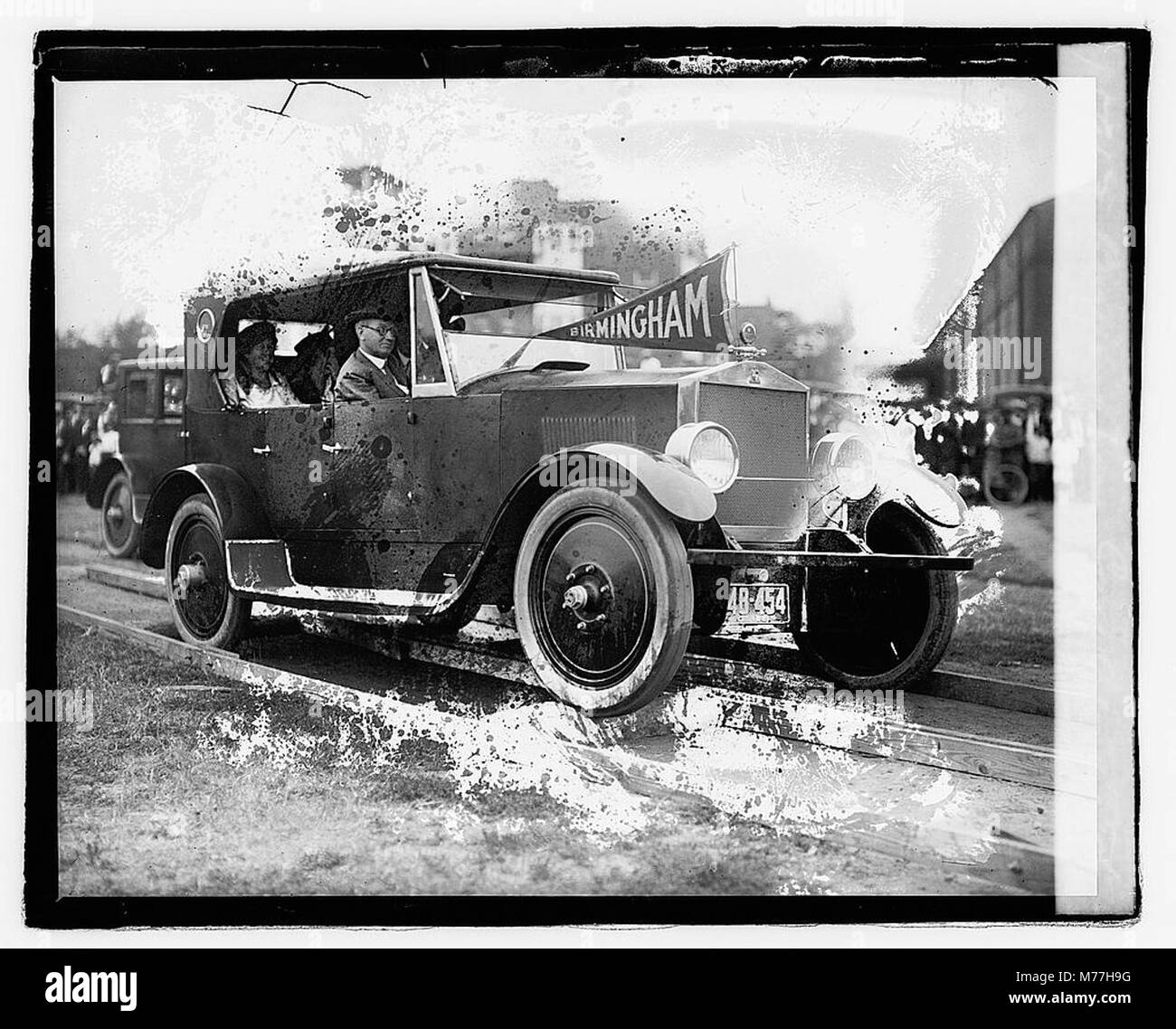 A historical image showing a car demonstration in Birmingham ...