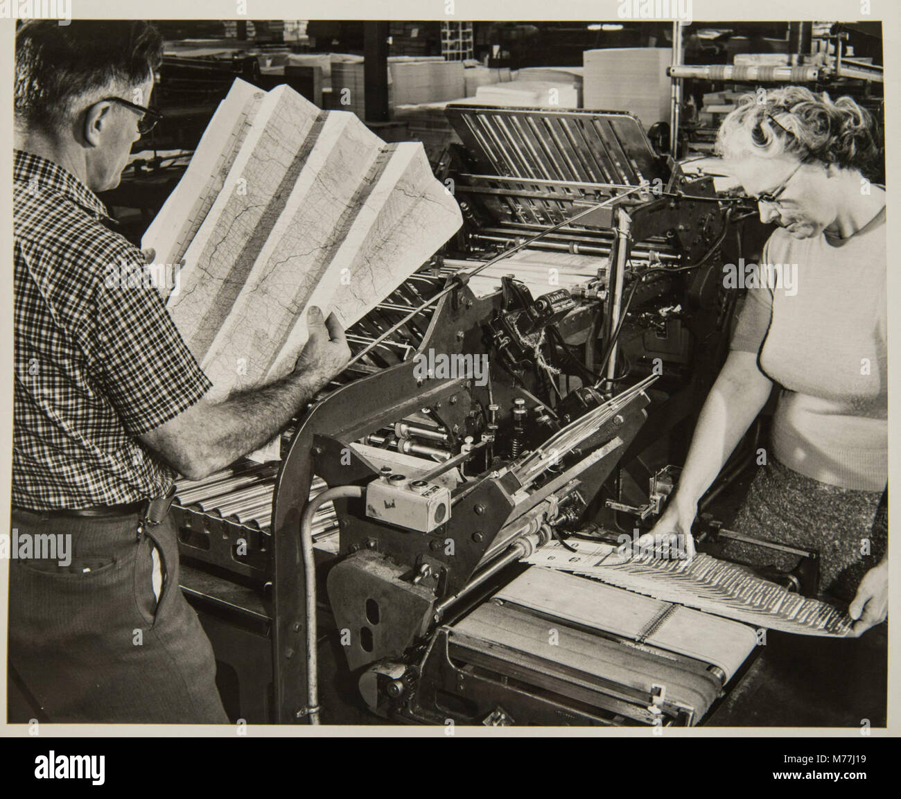 A photograph depicting the book manufacturing process, focusing on the ...