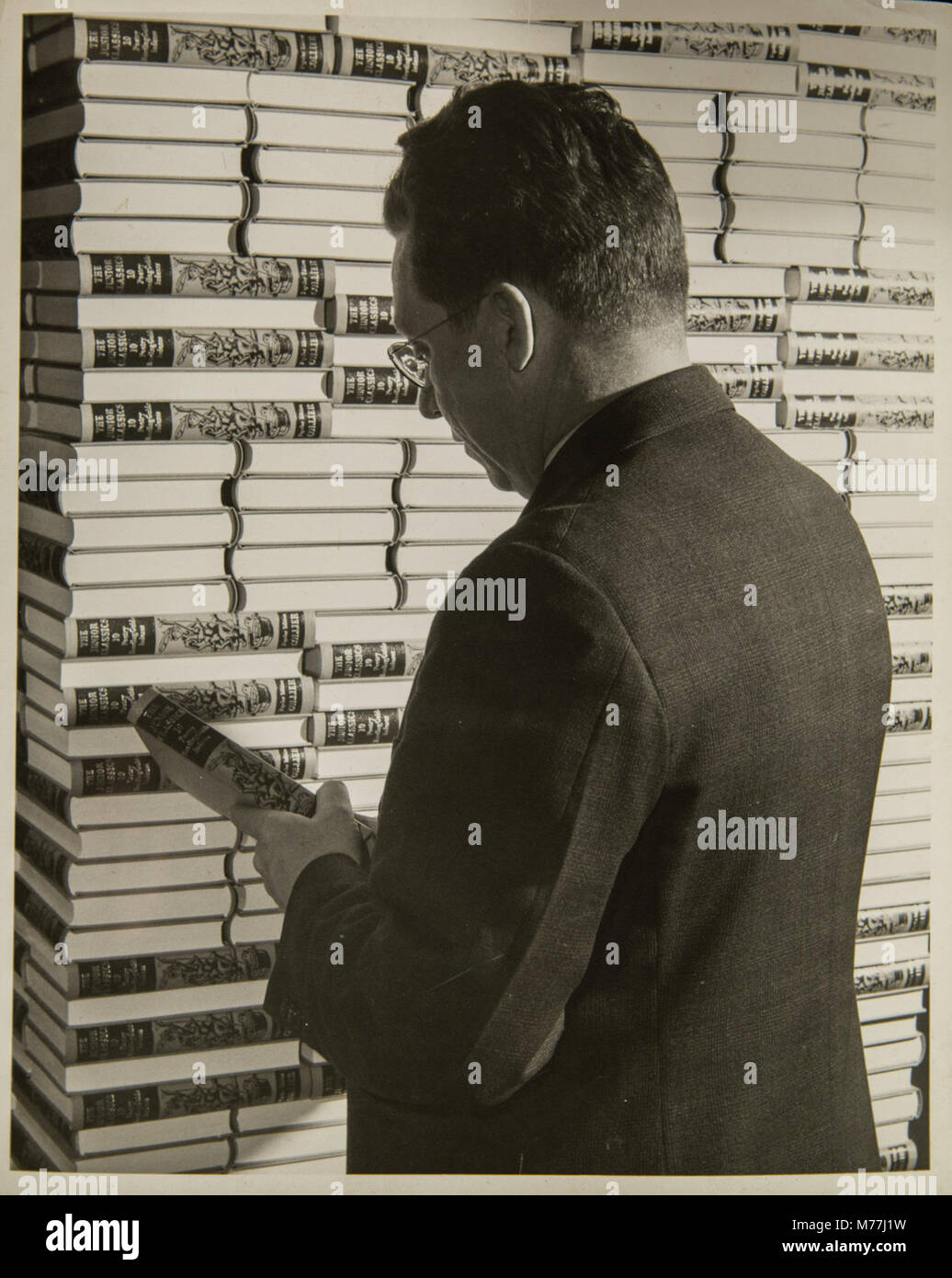 The image depicts the process of book manufacturing, focusing on ...