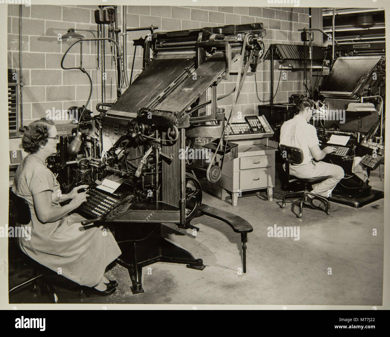 A photograph depicting the book manufacturing process, specifically ...