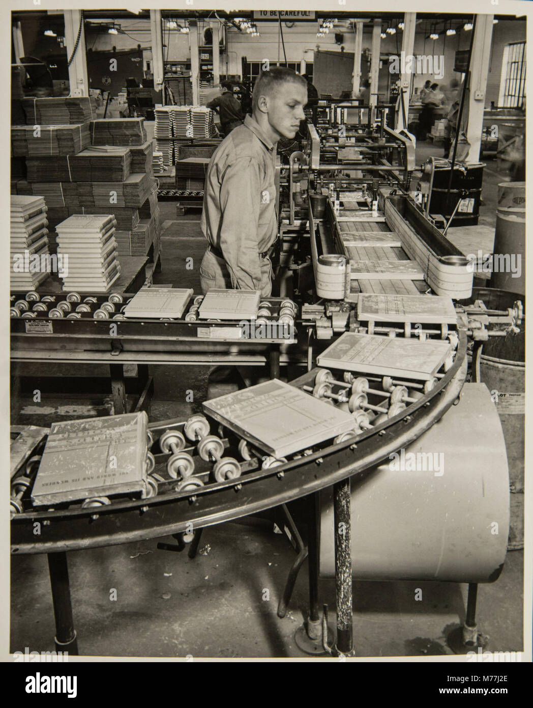 An image depicting the process of book manufacturing, focusing on ...