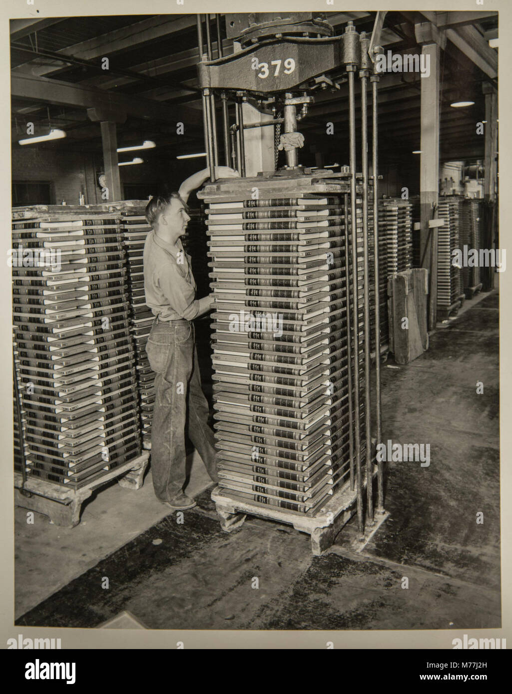 An image depicting the process of book manufacturing, specifically ...