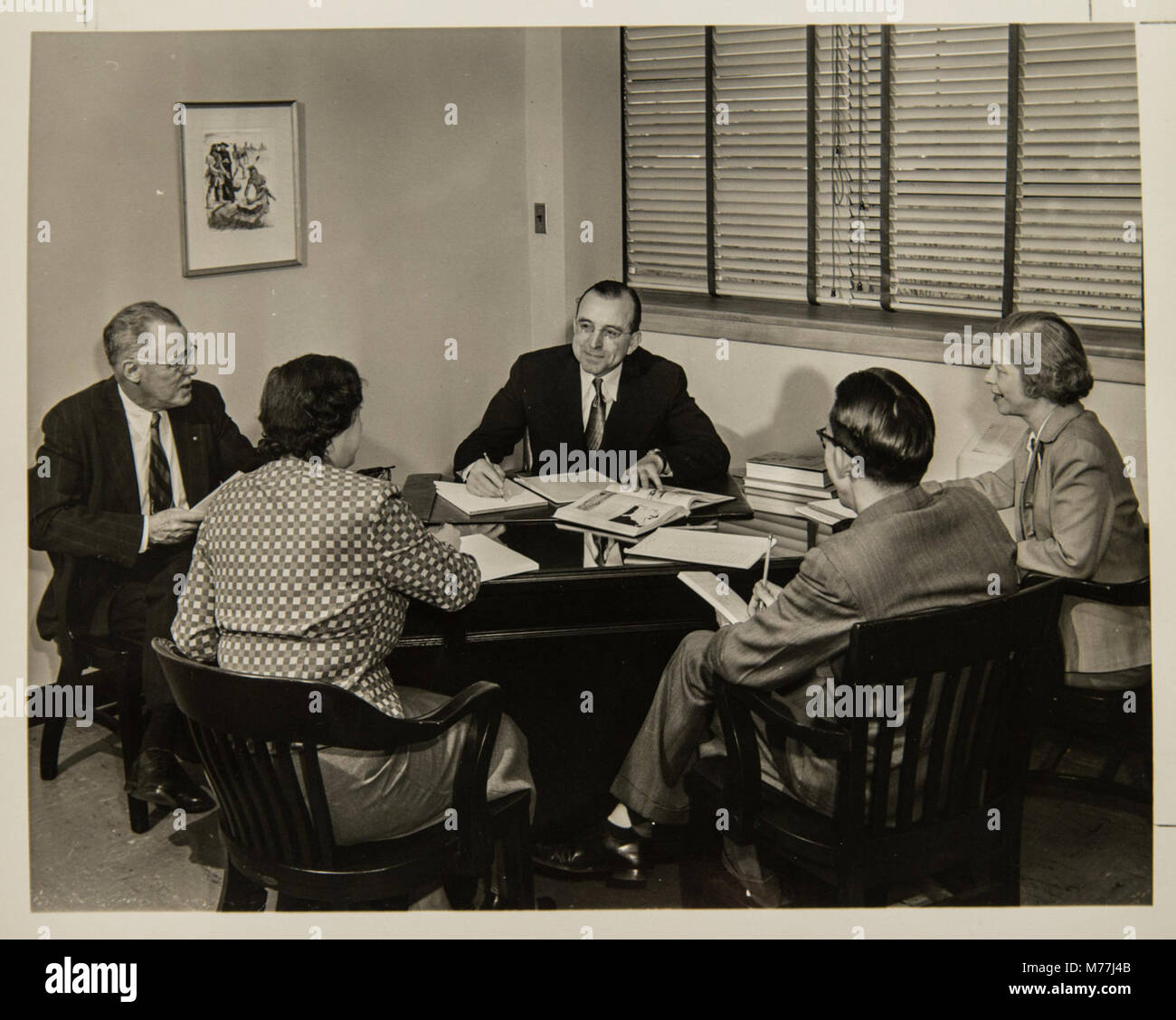 A detailed image showcasing the process of book manufacturing, focusing ...