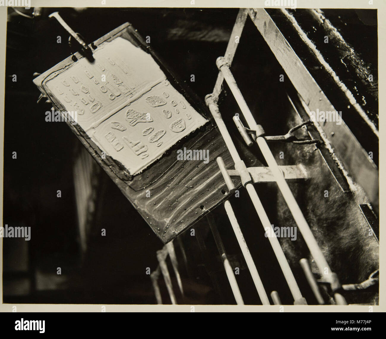 This image depicts the book manufacturing process at a foundry ...