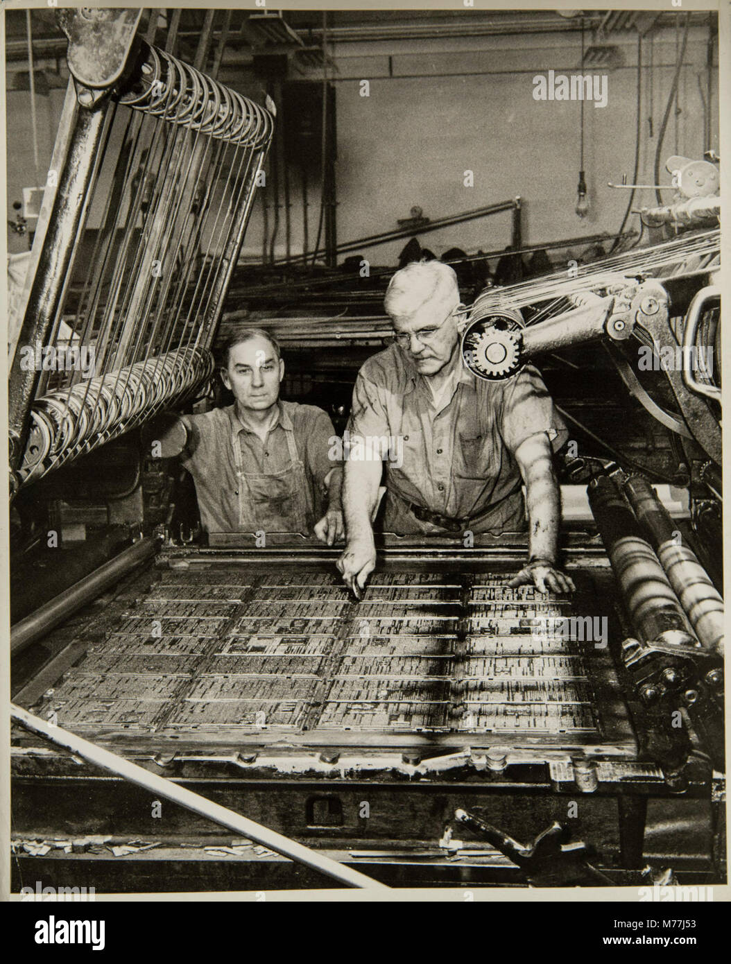 A historical image showing the letterpress process in book ...