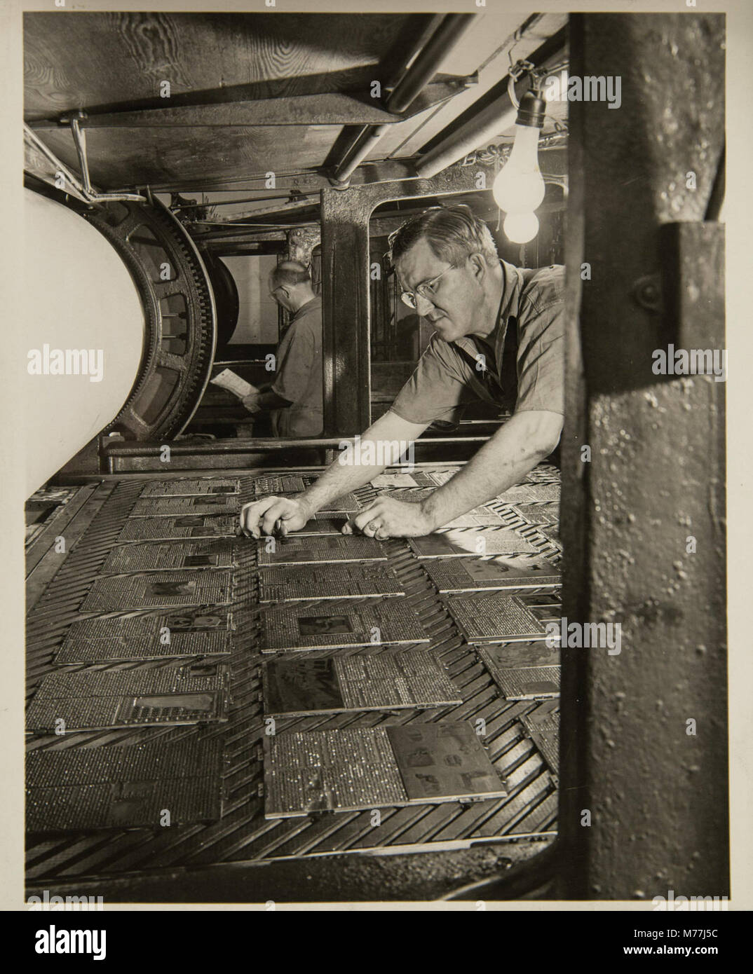 This photograph shows a letterpress used in book manufacturing ...