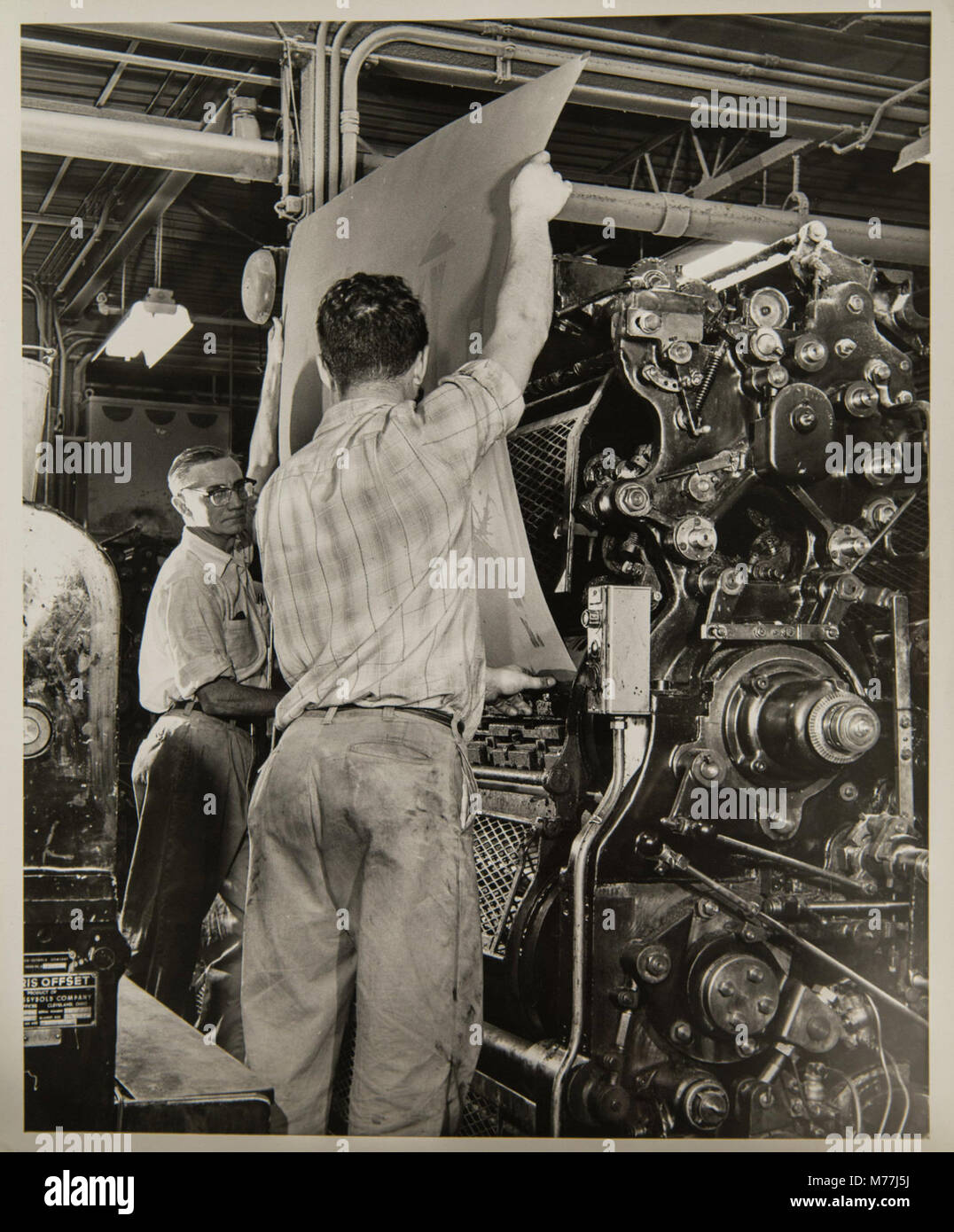 A photograph depicting the offset printing press in operation, used in ...