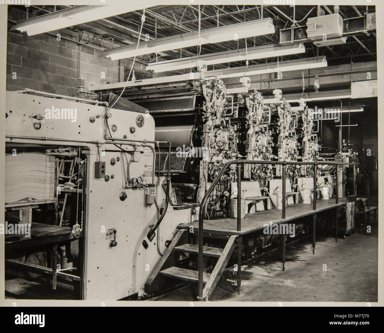 A photograph or illustration showing the process of book manufacturing ...