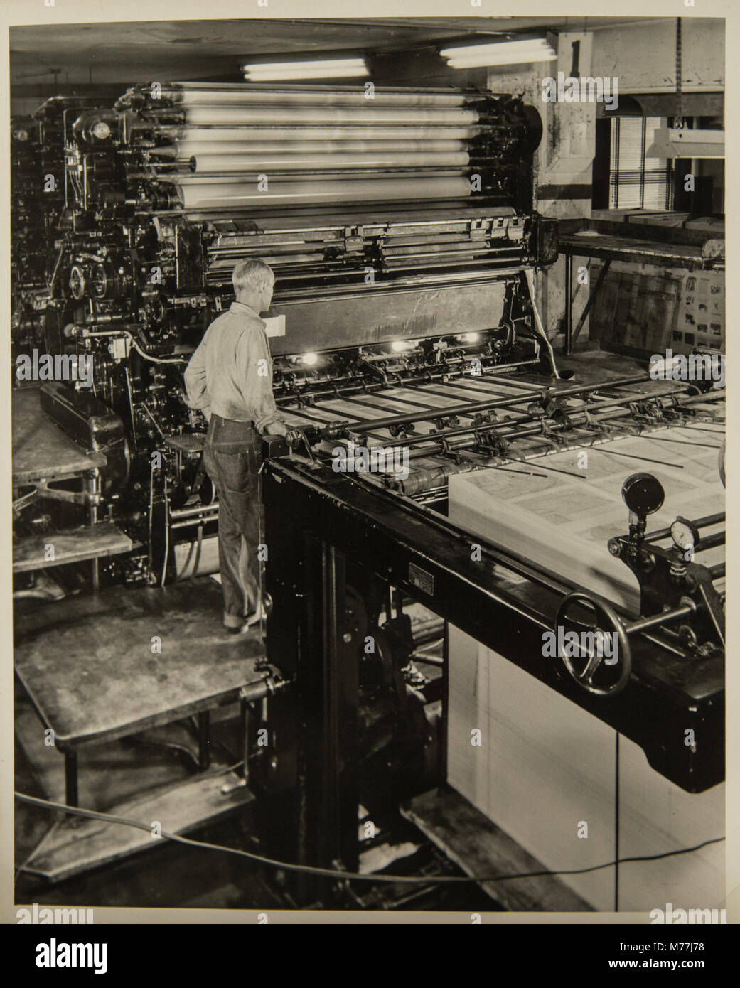 A detailed image depicting the process of book manufacturing using ...