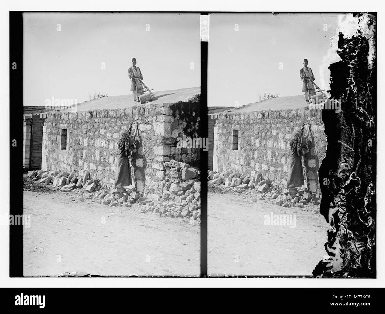 A photograph depicting the construction of a traditional native house ...