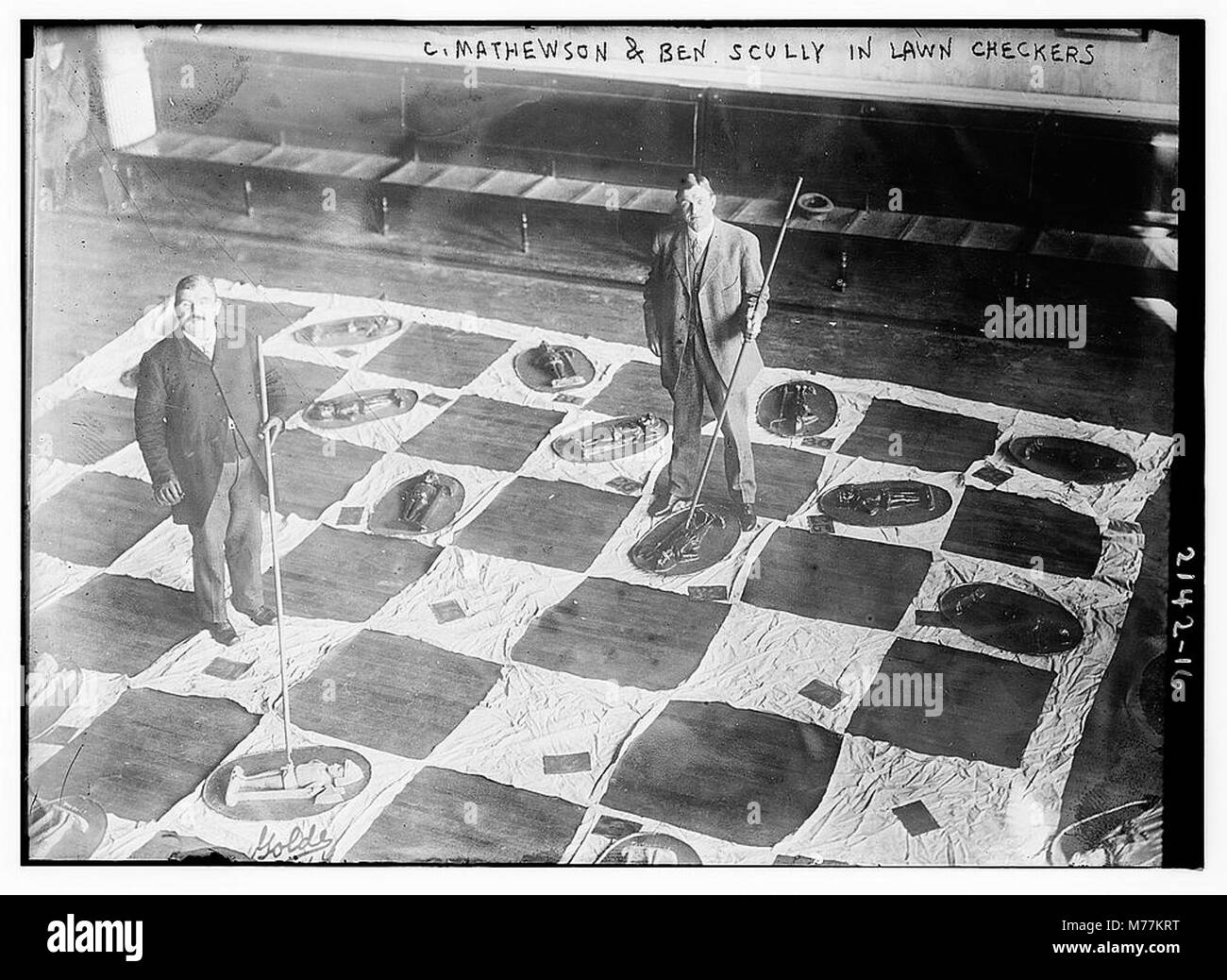 Baseball players C. Mathewson and Ben Scully are captured in a ...