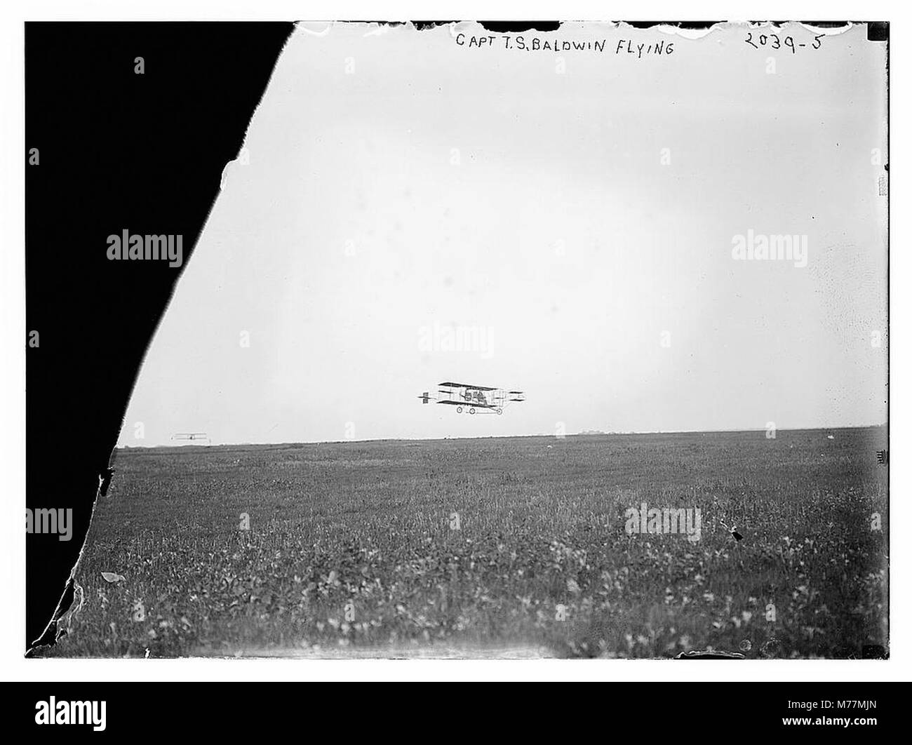 A historic photograph of Captain T.S. Baldwin, an early aviator, flying ...