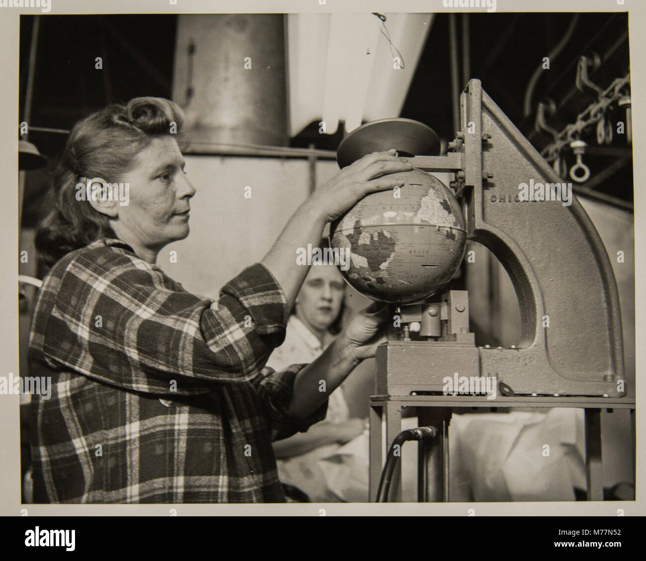 This image depicts the manufacturing process of globes by a ...