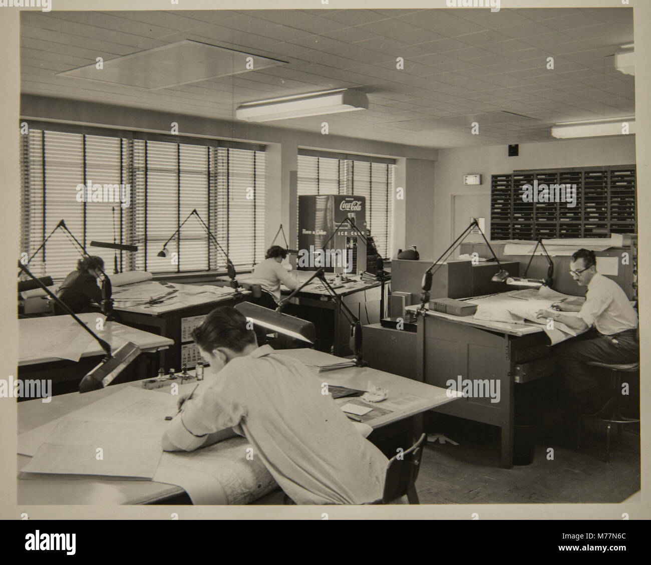 This image displays a selection of road maps and drafting tools used in ...