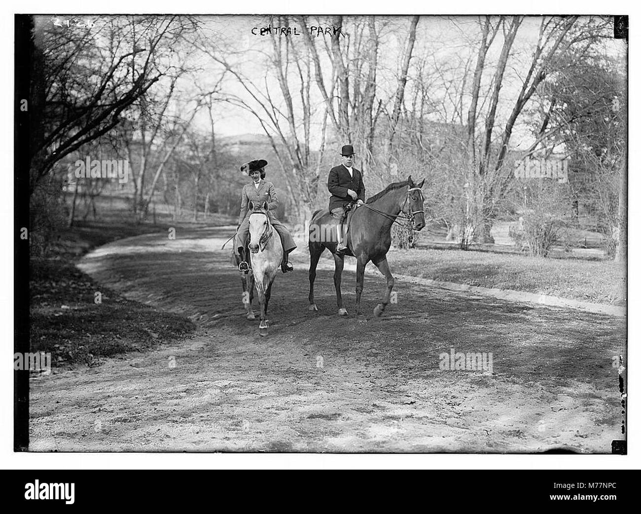 A photograph depicting people horseback riding in Central Park ...