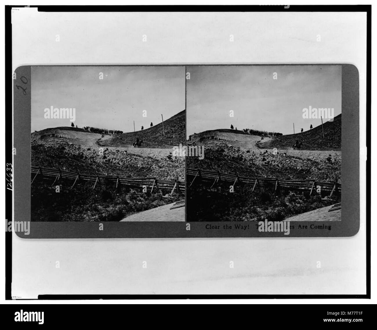 The image captures a dramatic scene where buffalo are approaching ...