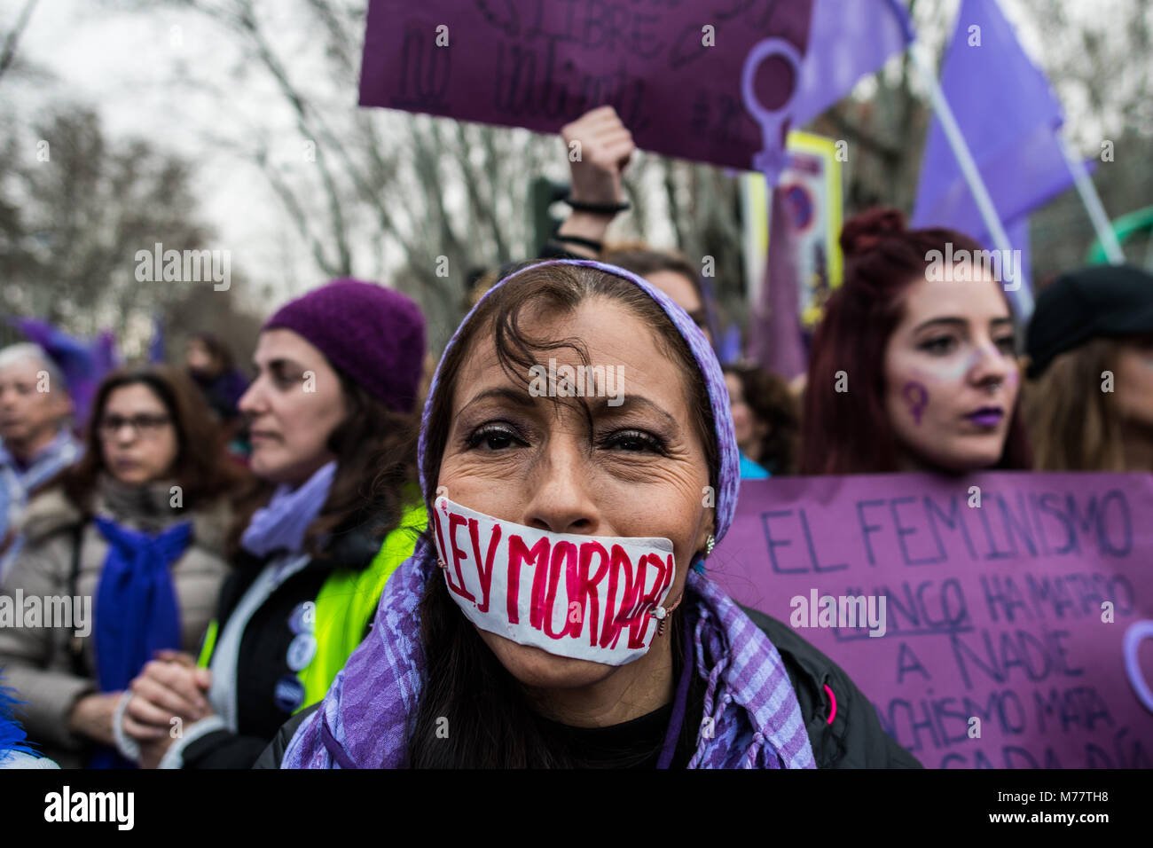 Madrid, Spain. 8th March, 2018. A woman with her mouth taped and the ...