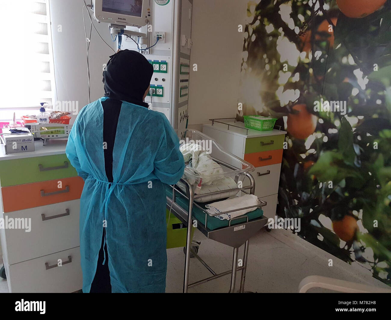 HANDOUT - 08 March 2018, Israel, Haifa: A Syrian woman stands beside a ...