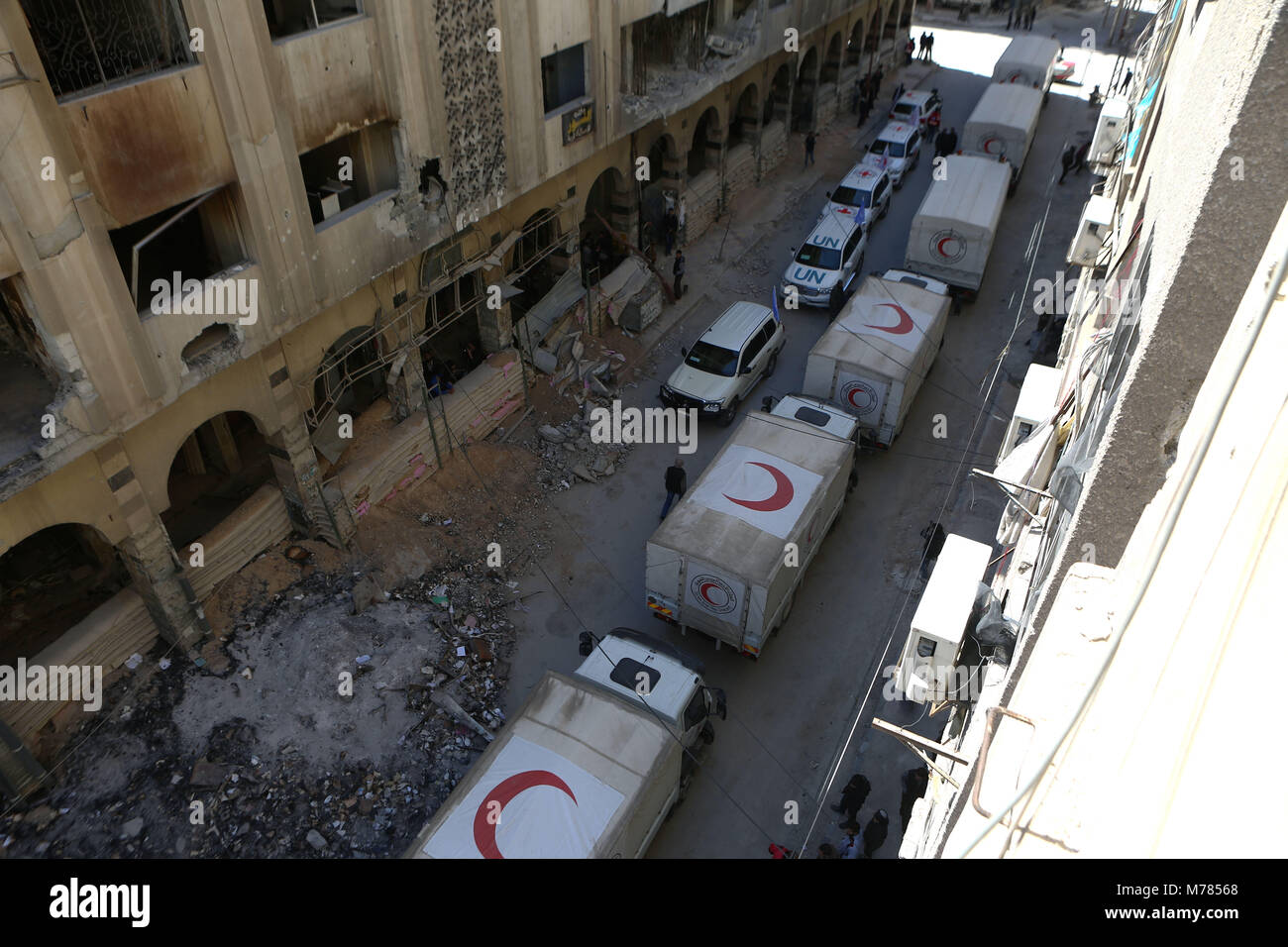 An aid convoy of the Syrian Arab Red Crescent drives through the rebel ...