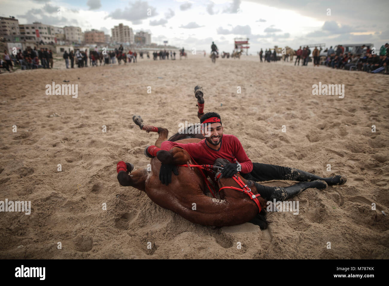 Gaza City, Gaza Strip. 09th Mar, 2018. A Palestinian horseman cuddles ...