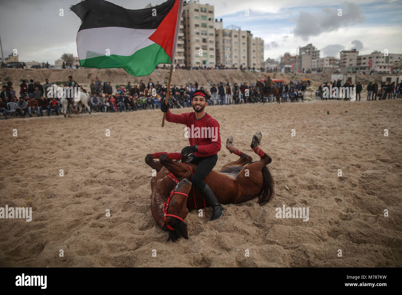 Gaza City, Gaza Strip. 09th Mar, 2018. A Palestinian horseman waves the ...