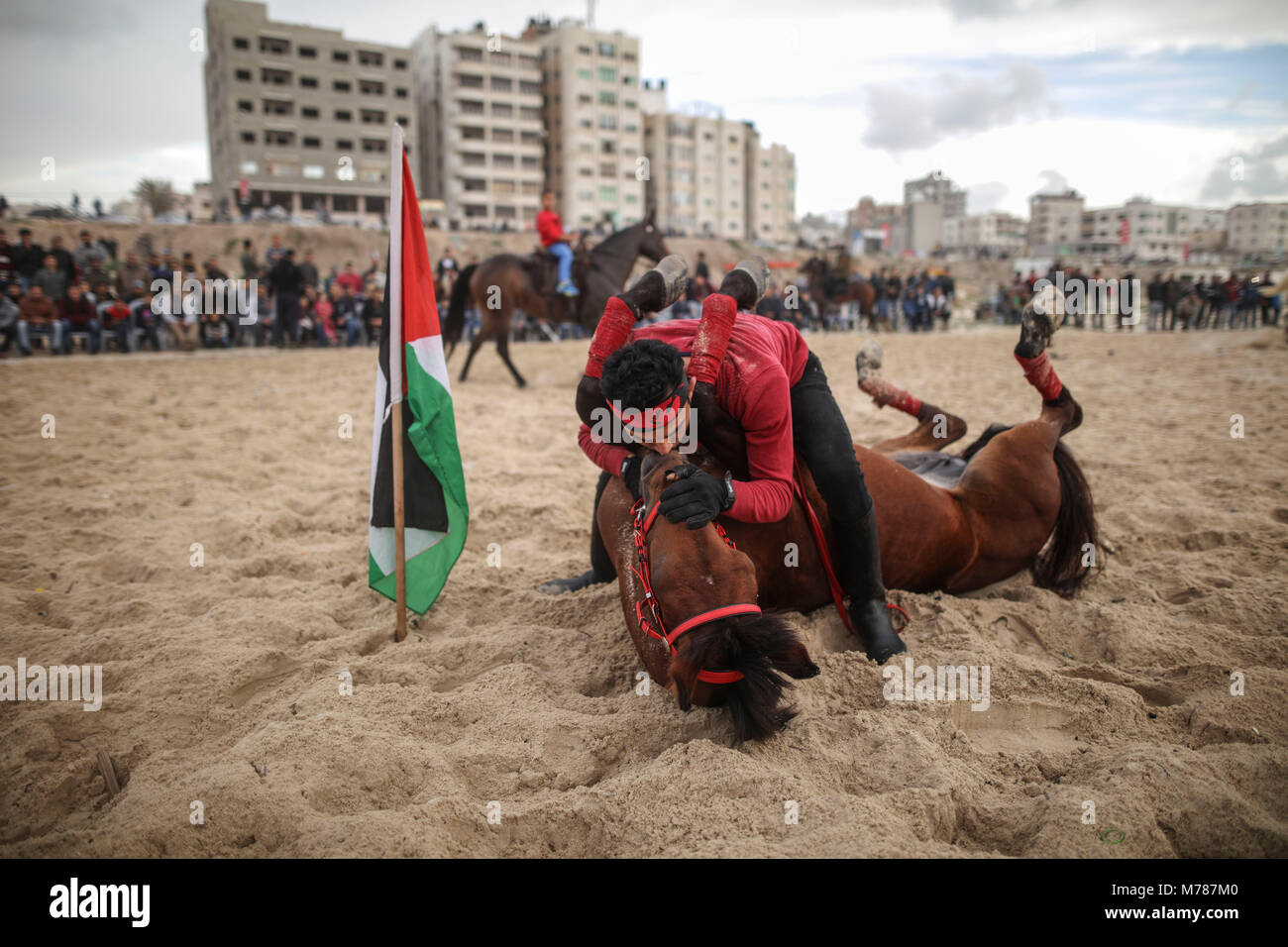 Gaza City, Gaza Strip. 09th Mar, 2018. A Palestinian horseman kisses ...