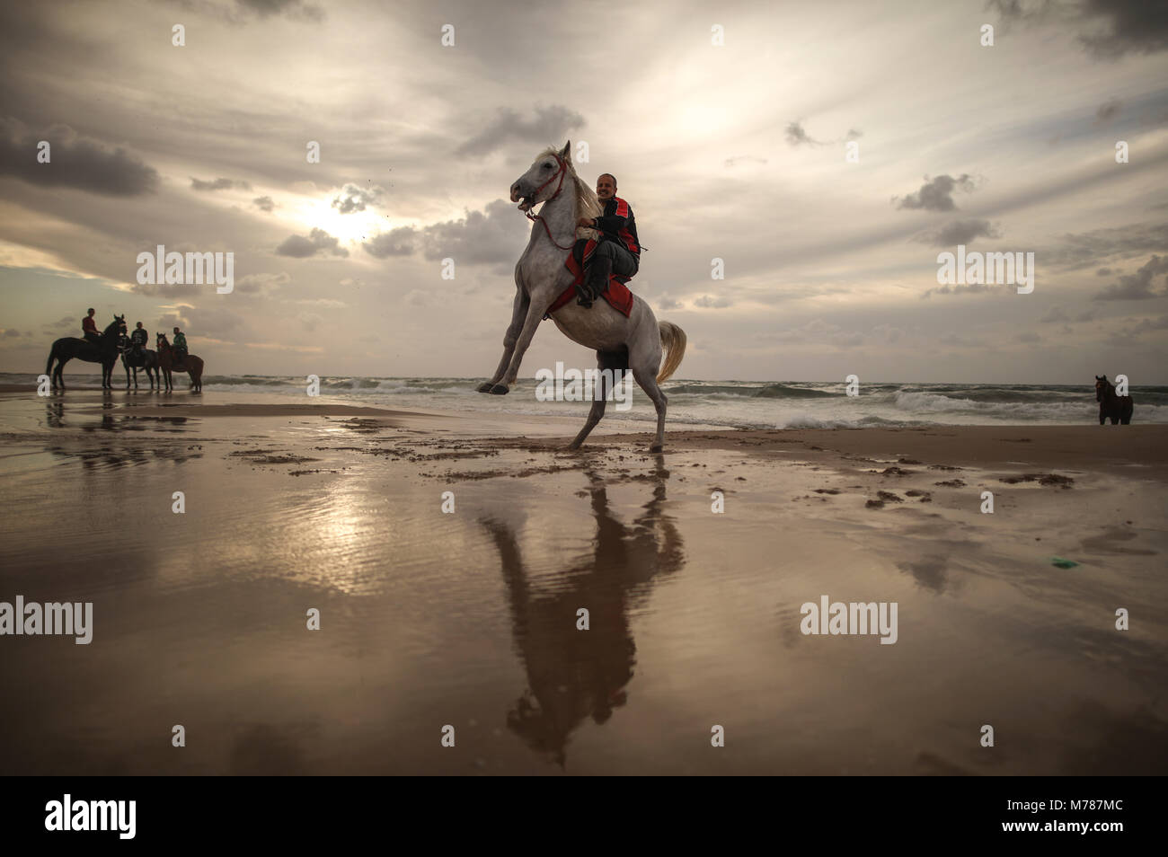 Gaza City, Gaza Strip. 09th Mar, 2018. A Palestinian man rides his ...