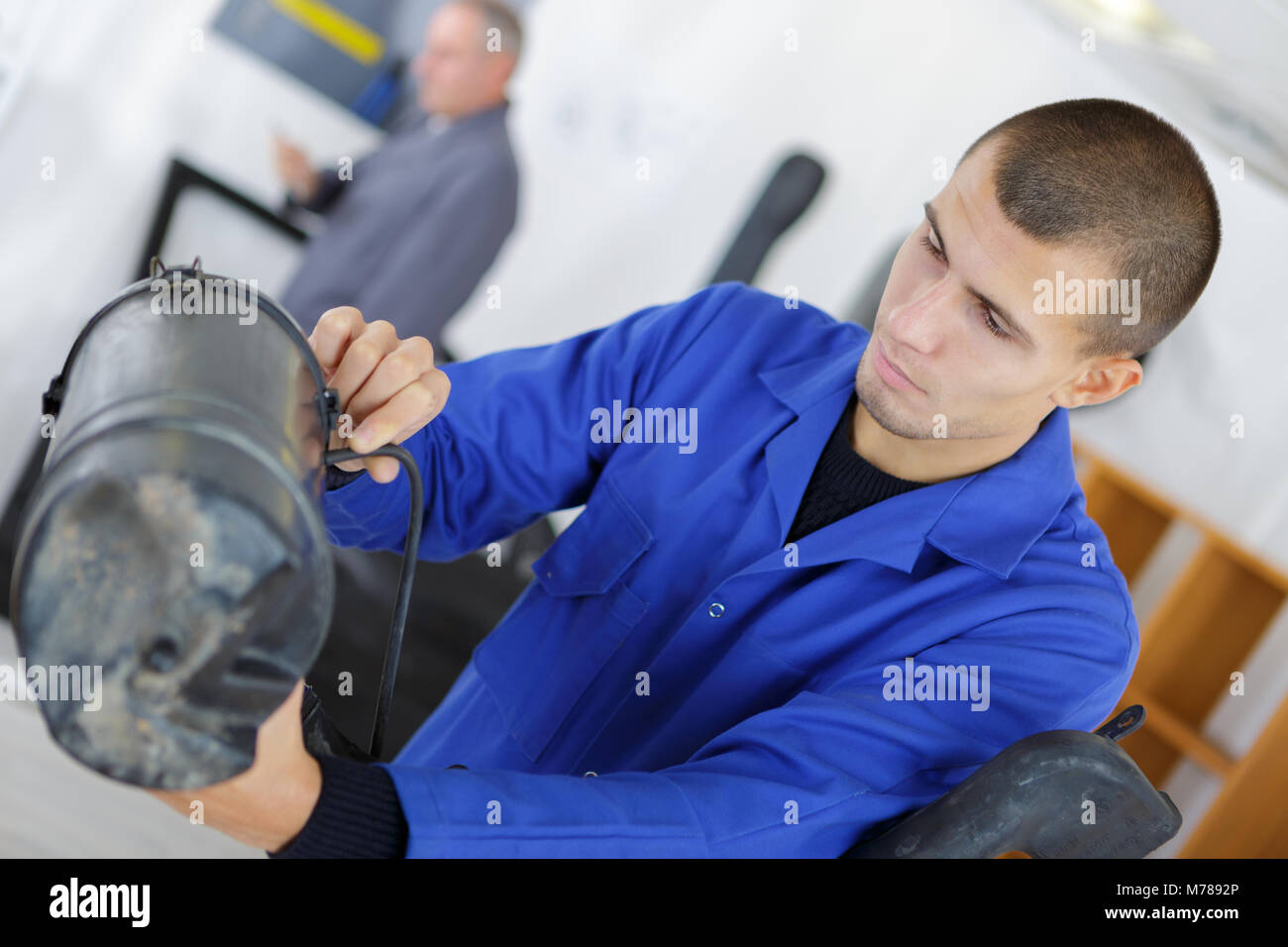 Teaching young mechanics hi-res stock photography and images - Alamy