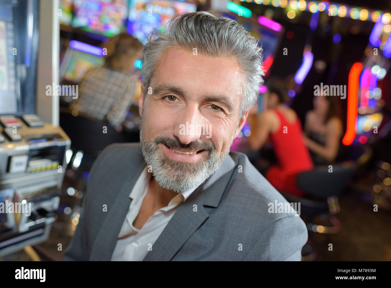 Sitting at gambling machine hi-res stock photography and images - Alamy