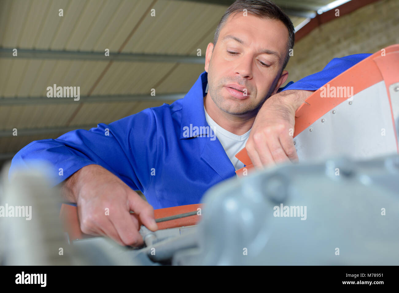 worker busy fixing Stock Photo - Alamy