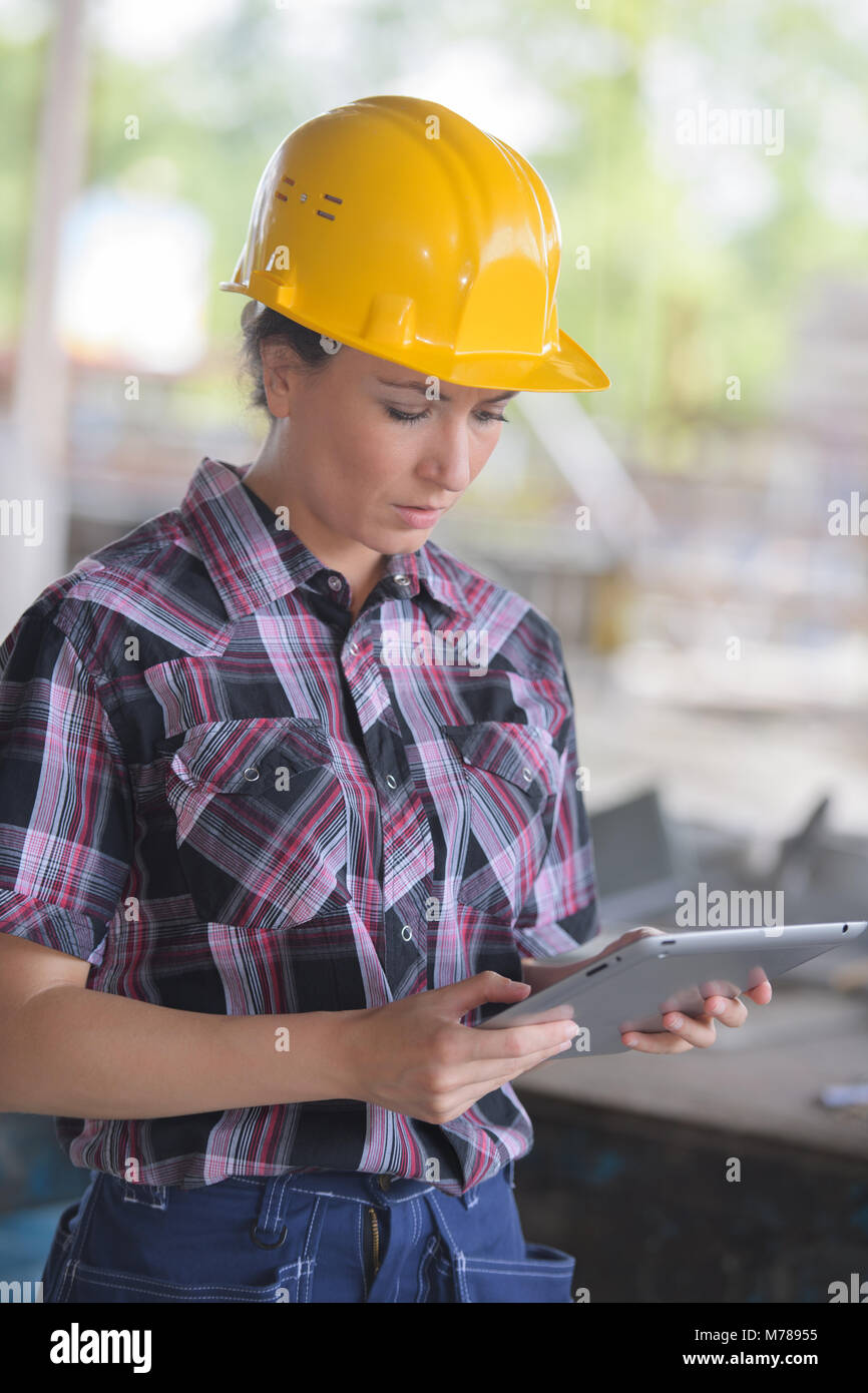 female worker using a tablet Stock Photo - Alamy