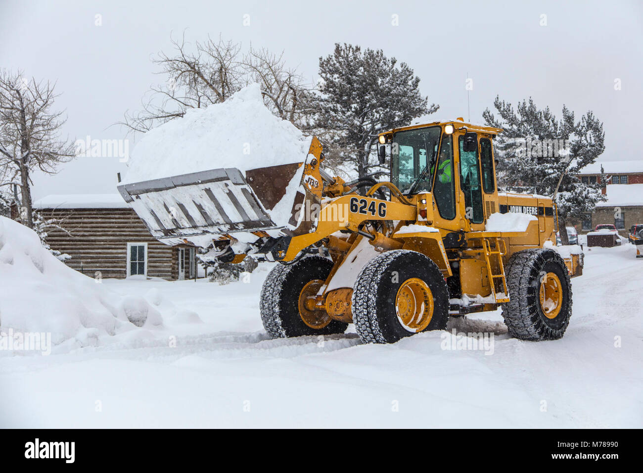 Clearing snow away in Mammoth with a front-end loader (3 Stock Photo ...