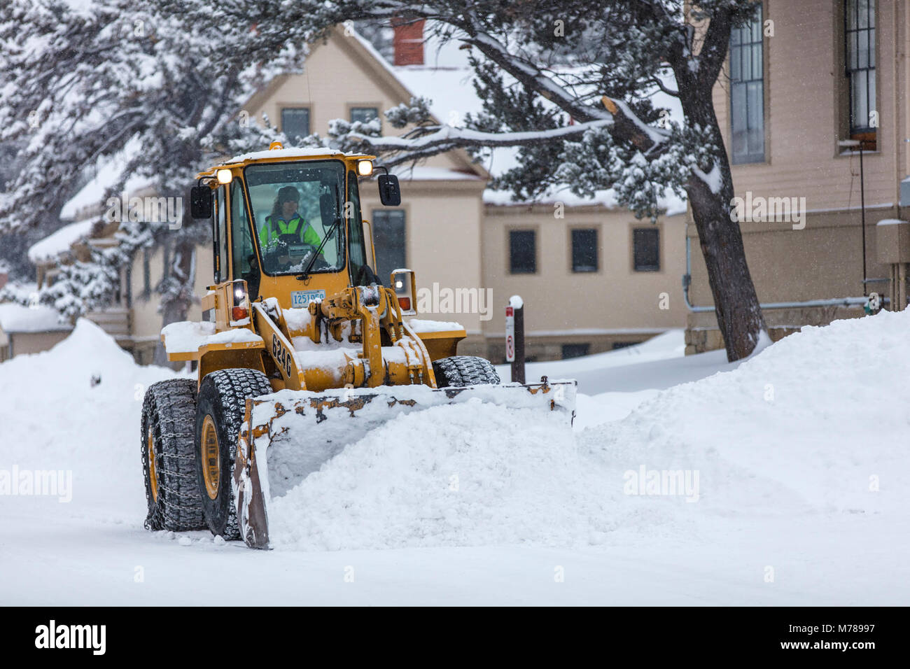 Clearing snow away in Mammoth with a front-end loader Stock Photo - Alamy