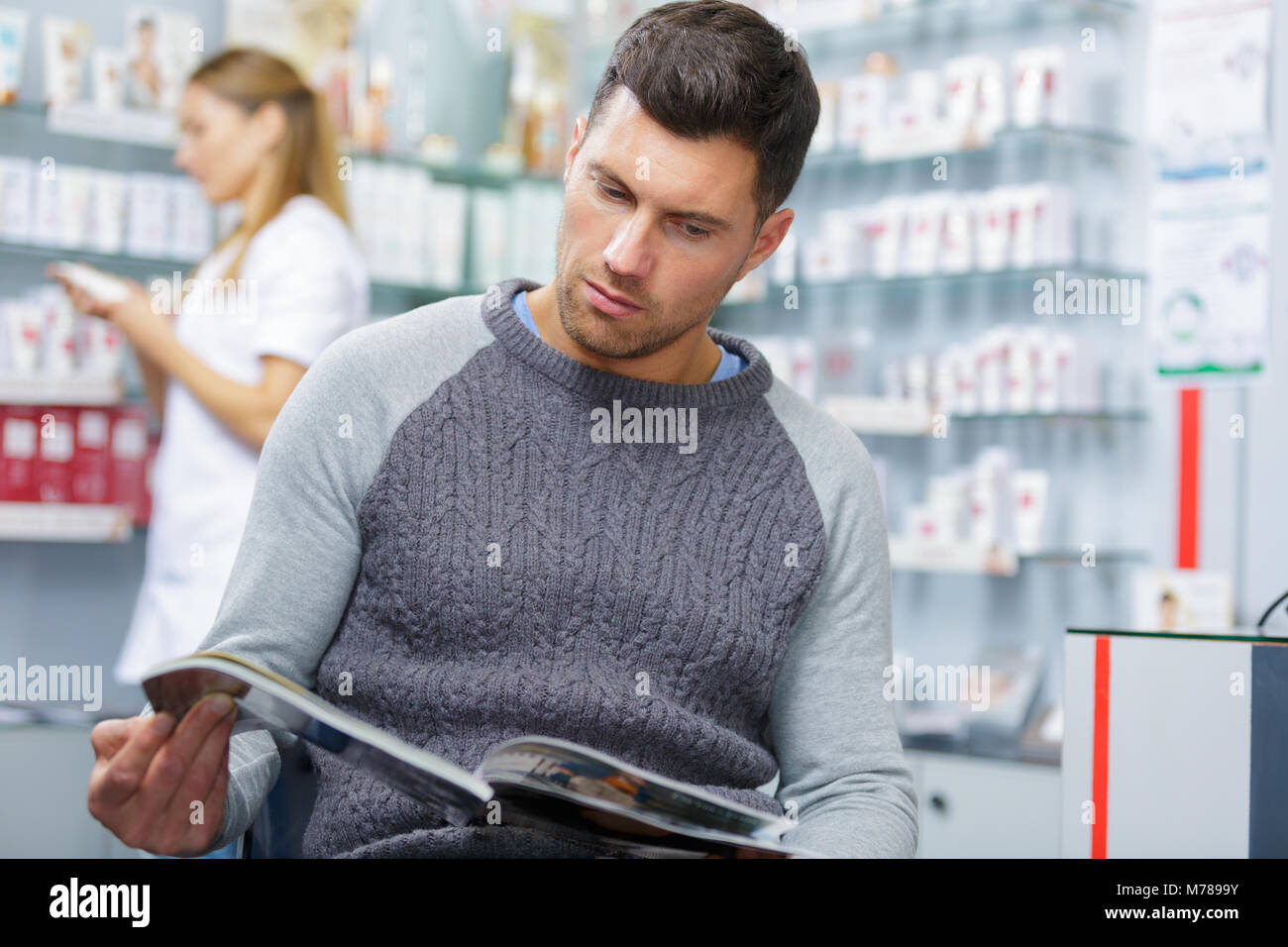 Handsome pharmacist in pharmacy hi-res stock photography and images - Alamy