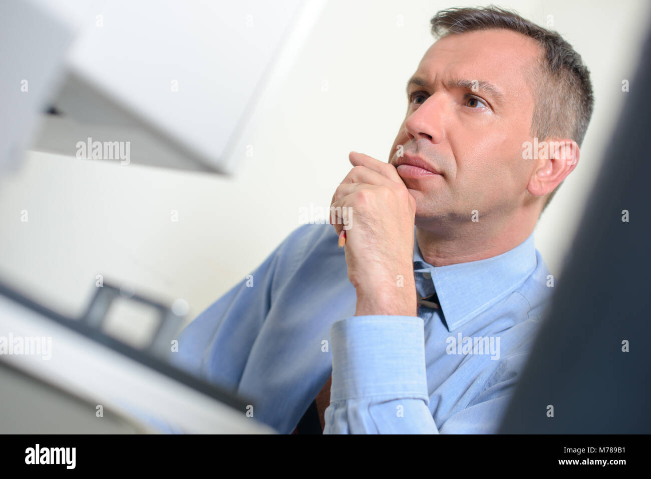 Man focused on computer screen Stock Photo - Alamy