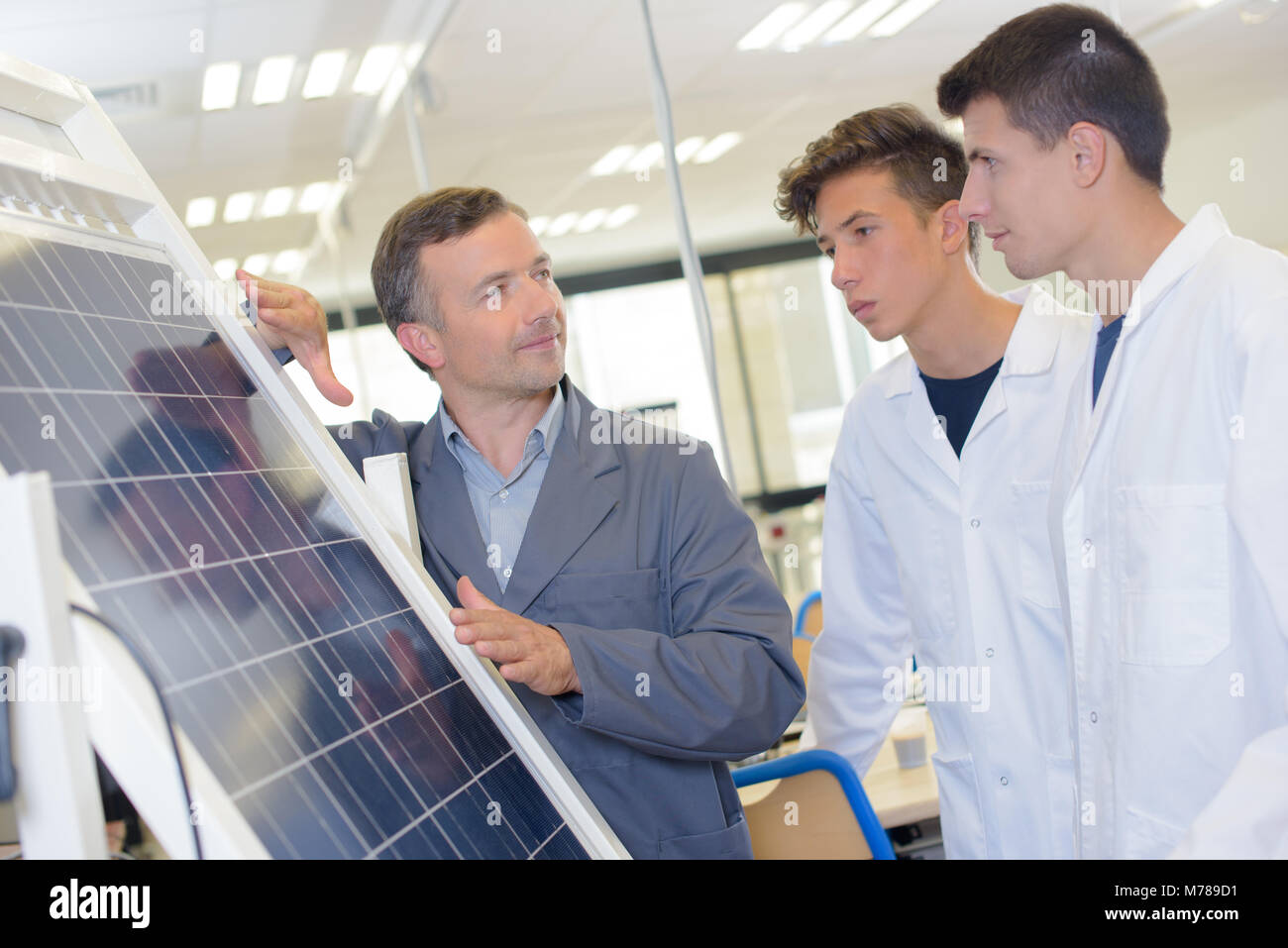 Students being showed a solar panel Stock Photo - Alamy