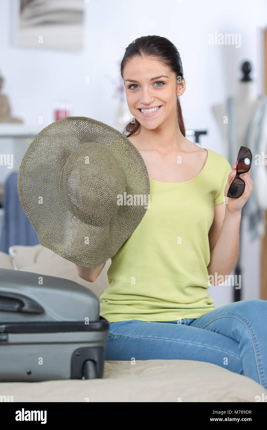 Female packing suitcase hi-res stock photography and images - Alamy