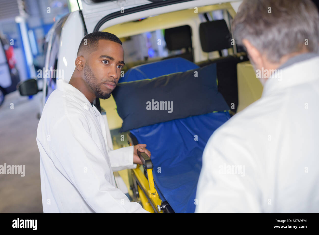 ambulance with a doctor ready Stock Photo - Alamy