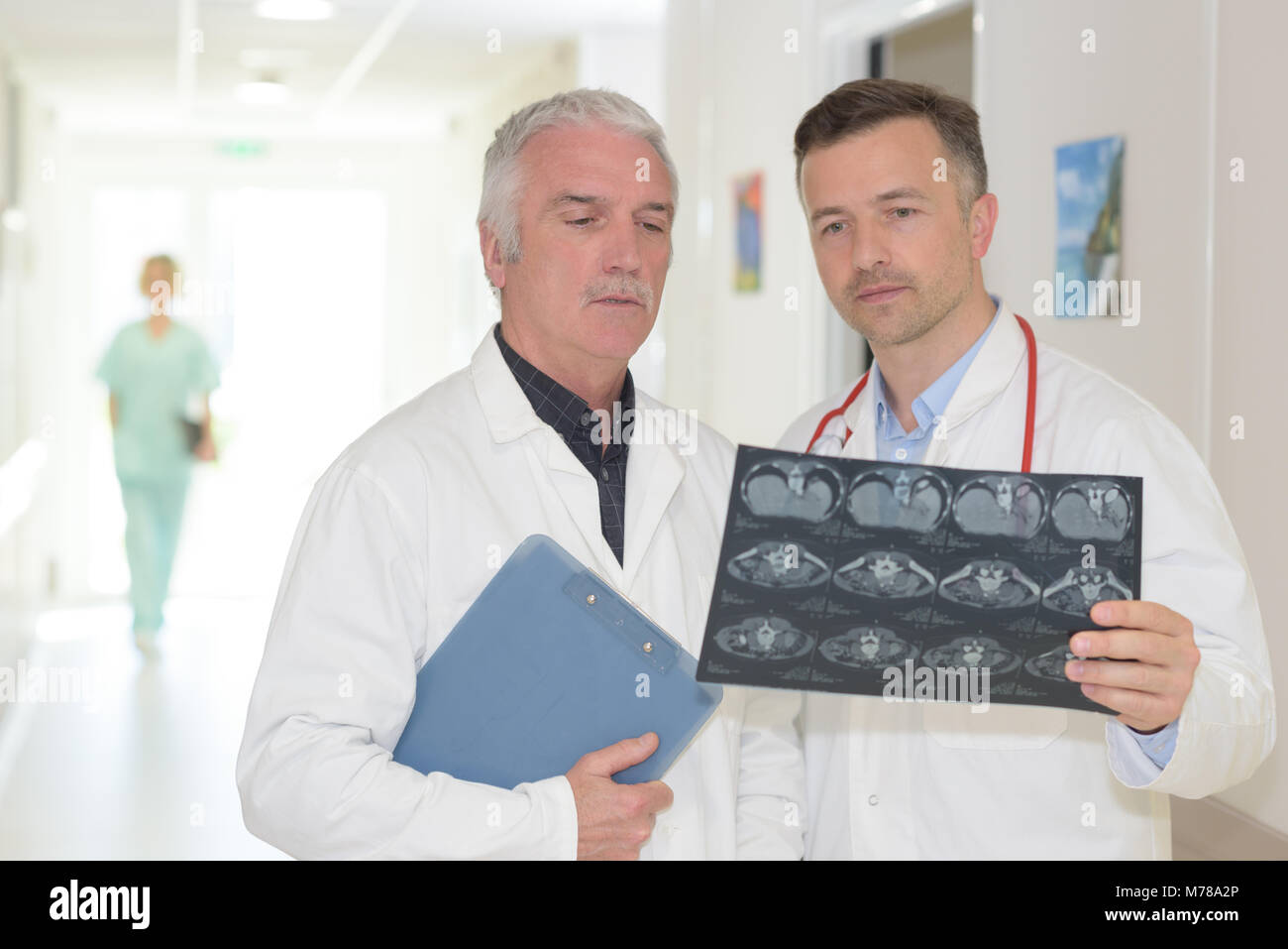 two mature male radiologist holding x-ray Stock Photo - Alamy