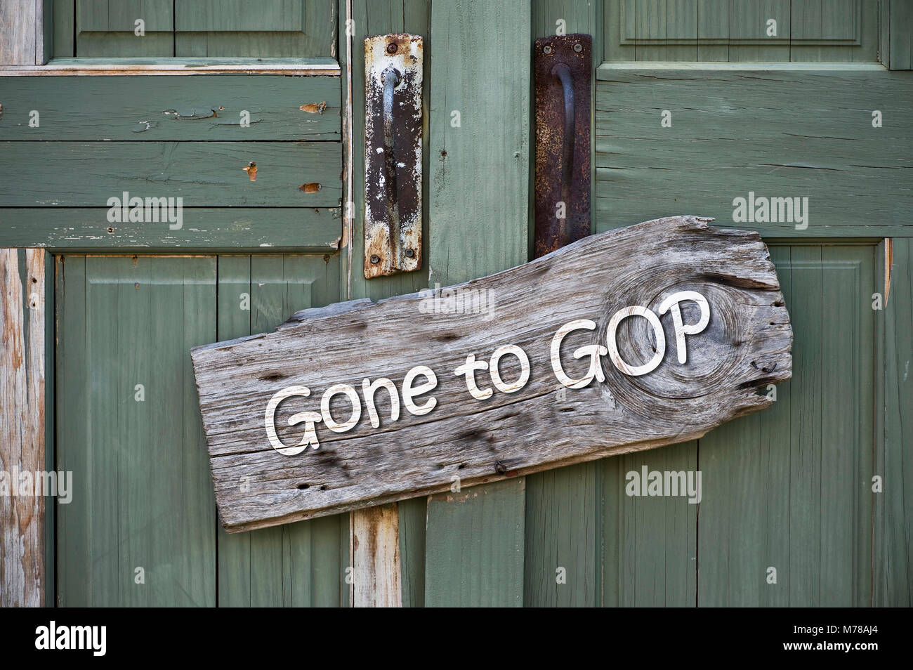 Gone to GOP sign on old green doors Stock Photo - Alamy