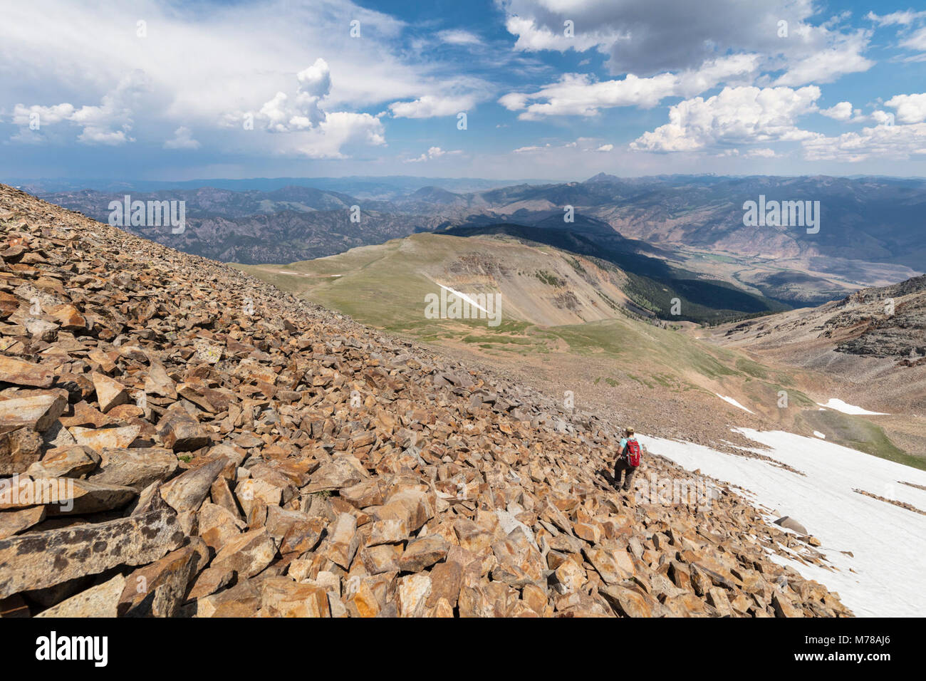 Hiker descending north face talus slope on Electric Peak Stock Photo ...