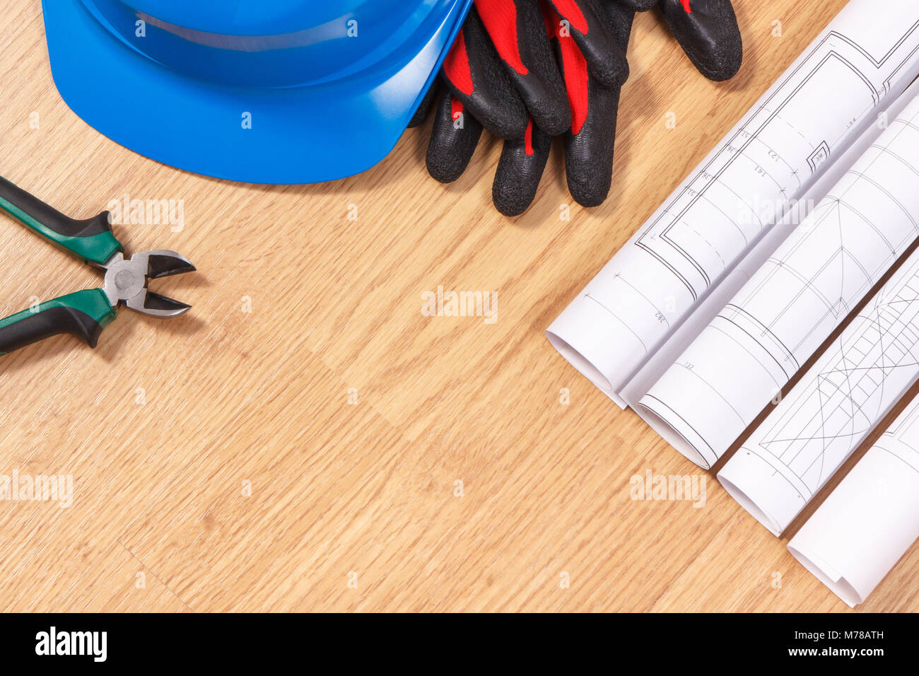 Rolls of diagrams and electrical construction drawings, protective blue ...