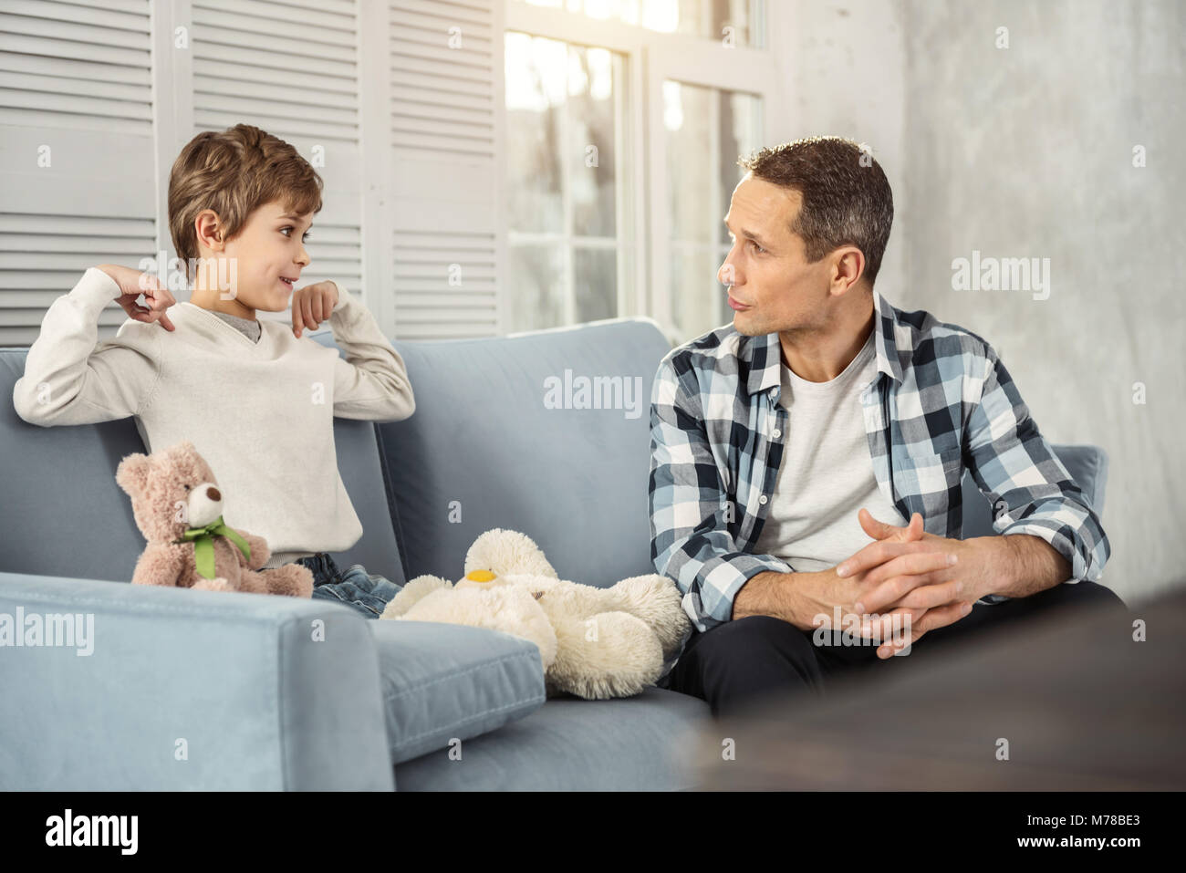 Inspired boy talking with his daddy Stock Photo - Alamy