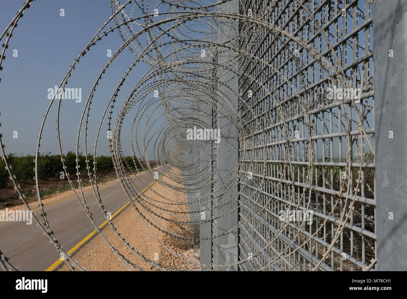 Barbed wire fence along the border with Syria in the southern Golan ...