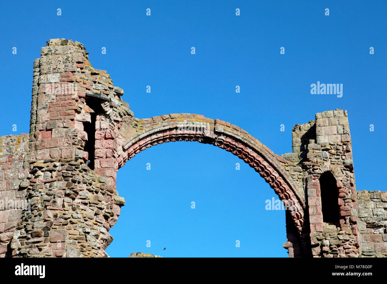 The rainbow arch of Lindisfarne Priory Church, Holy Island Stock Photo ...